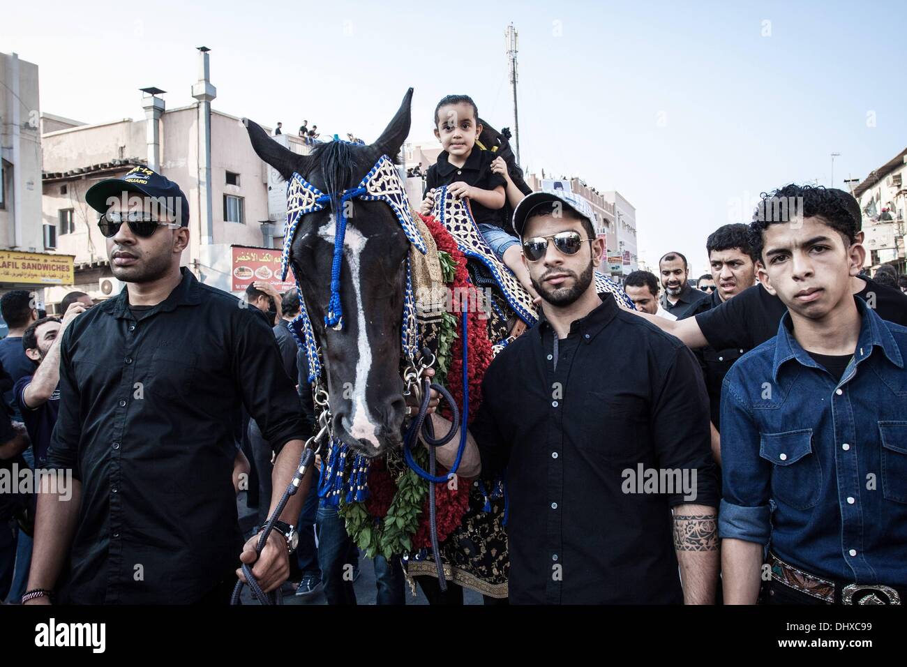 Manama, Bahrain. 15th Nov, 2013. Ritual of Muharram morning in Manama ...