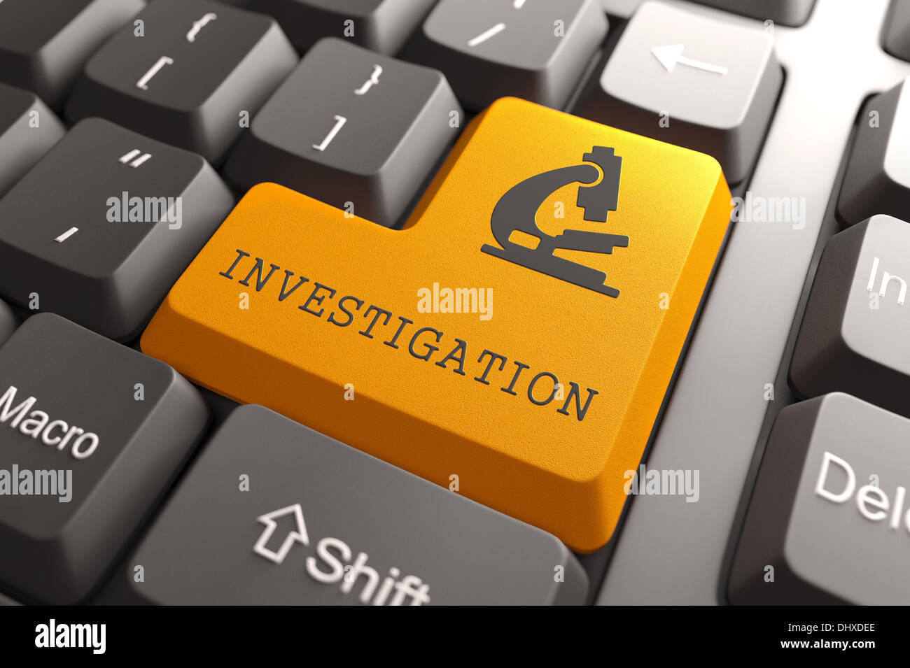 Keyboard with Investigation Orange Button Stock Photo - Alamy