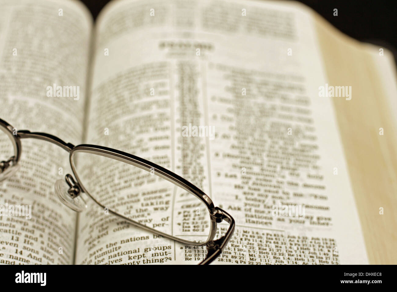 A close up image of a bible with reading glasses Stock Photo - Alamy