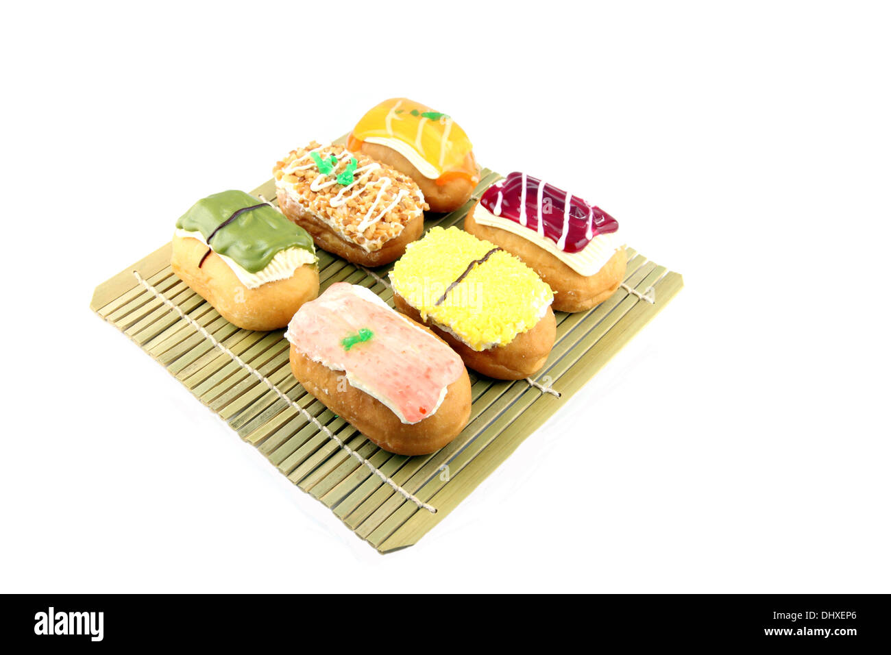 Mix color Sushi Donuts in bamboo dish on white background Stock Photo ...