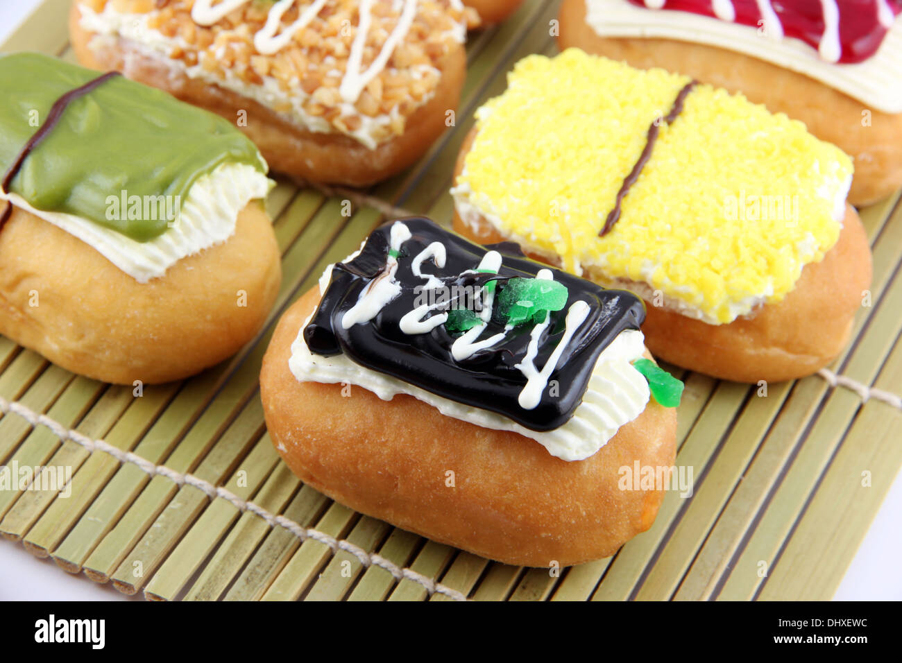 Closeup Mix color Sushi Donuts in bamboo dish on white background Stock ...