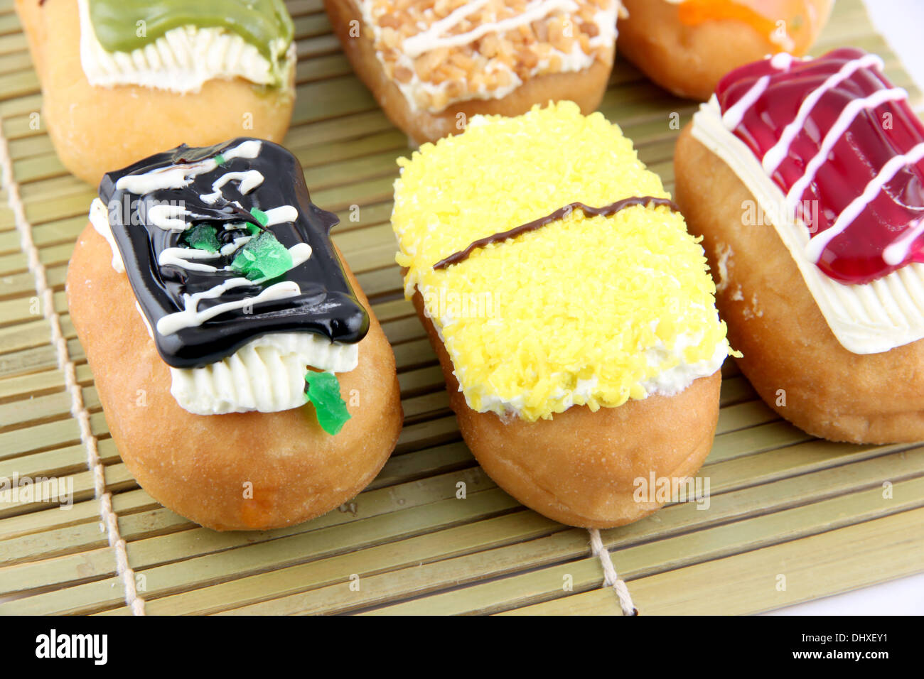 Closeup Mix color Sushi Donuts in bamboo dish on white background Stock ...