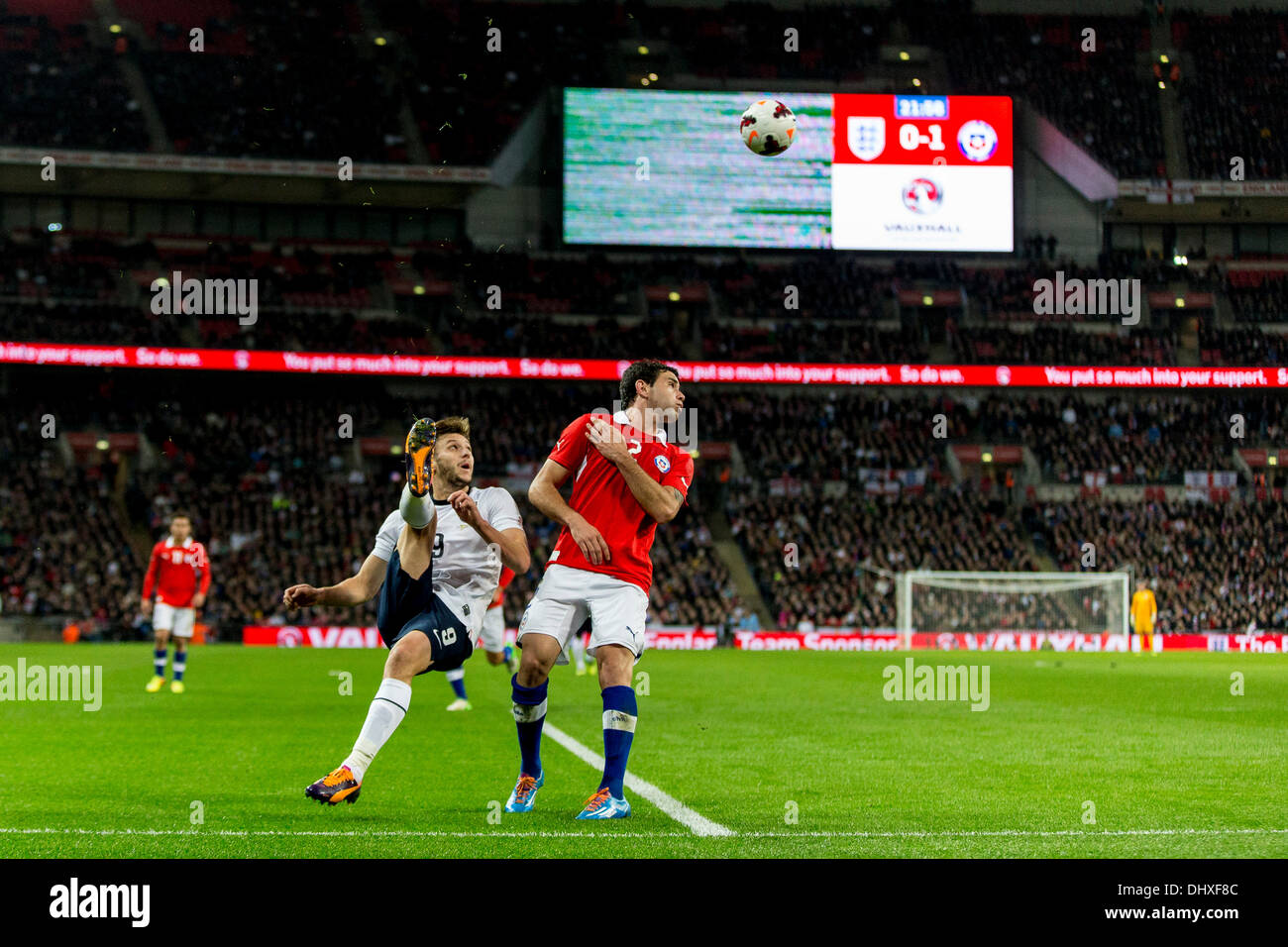 London, UK. 15th Nov, 2013. England's Adam LALLANA gets an unorthodox ...