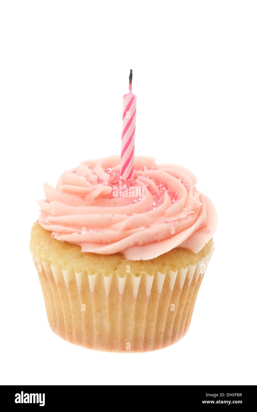 Pink buttercream iced cupcake with a single birthday candle - studio ...