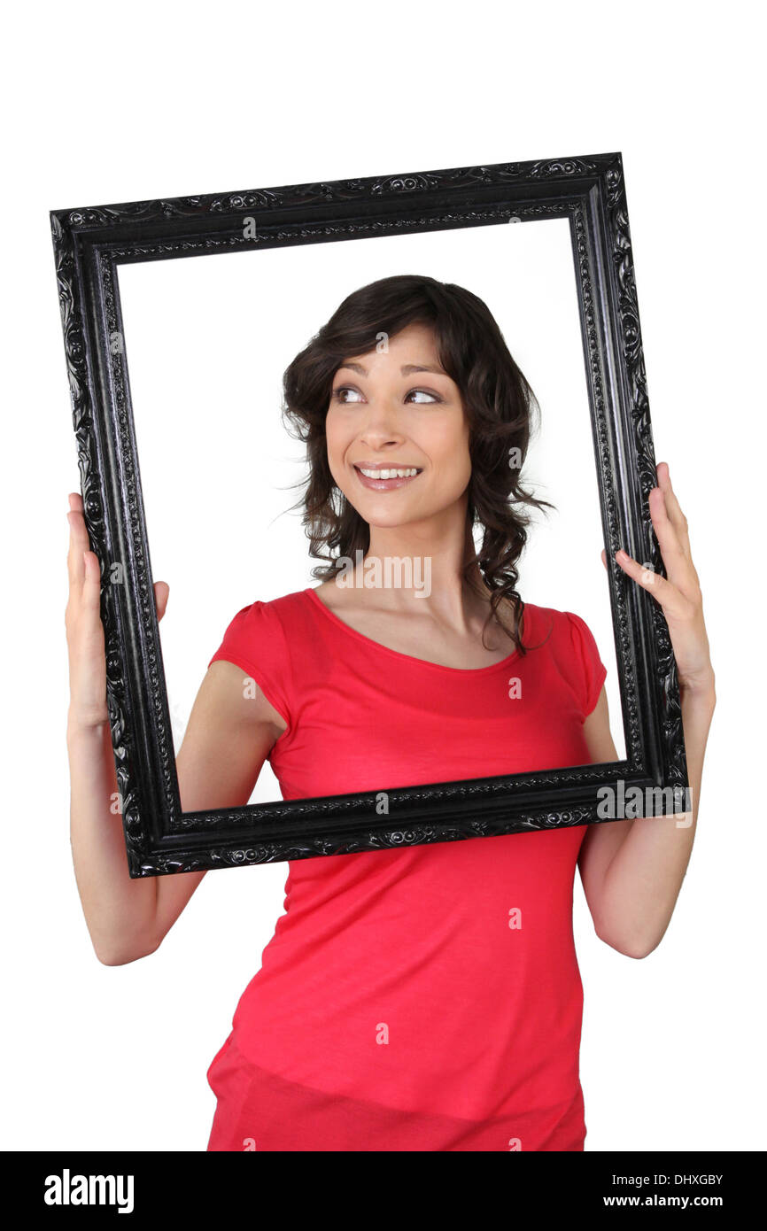 a woman holding a wooden frame Stock Photo - Alamy