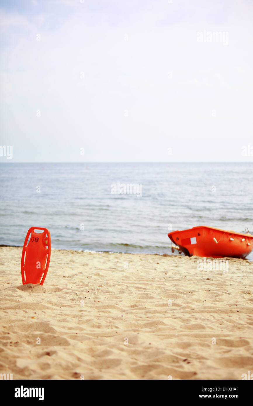 Beach life-saving. Lifeguard rescue equipment orange preserver tool and ...