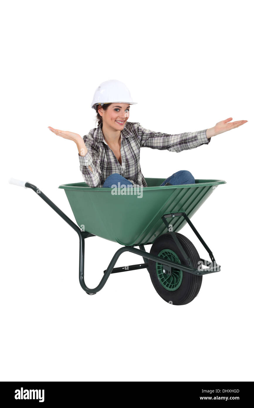 Woman sat in wheelbarrow Stock Photo - Alamy