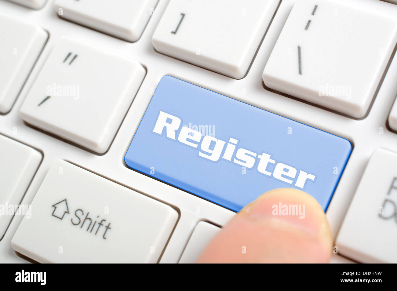 Pressing register key on keyboard Stock Photo - Alamy