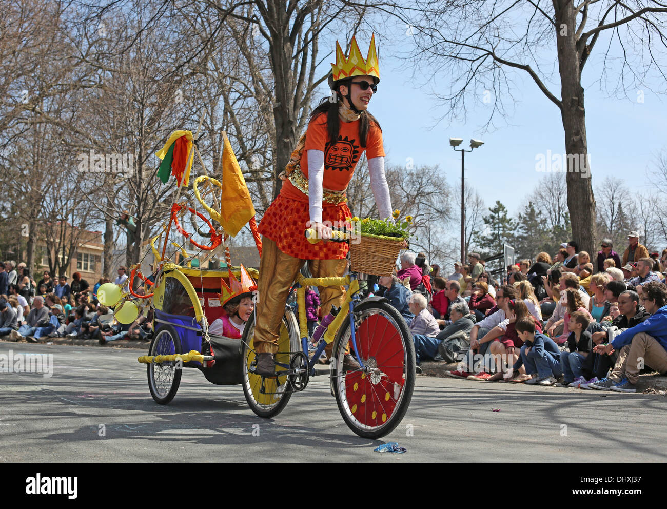 A woman and child on a bicycle at the May Day parade in Minneapolis ...