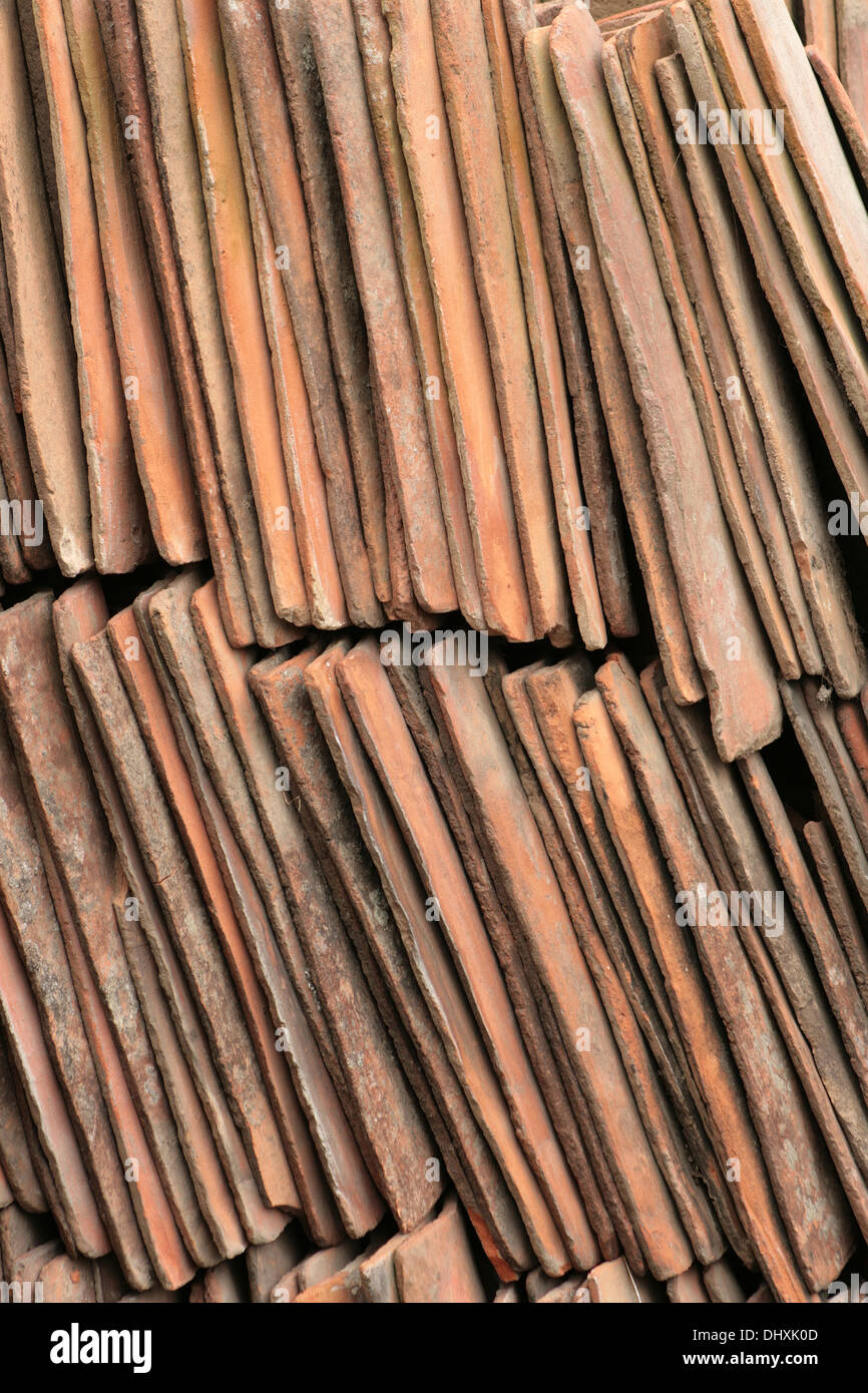Stacked terracotta roofing tiles at a construction site in Cotacachi ...