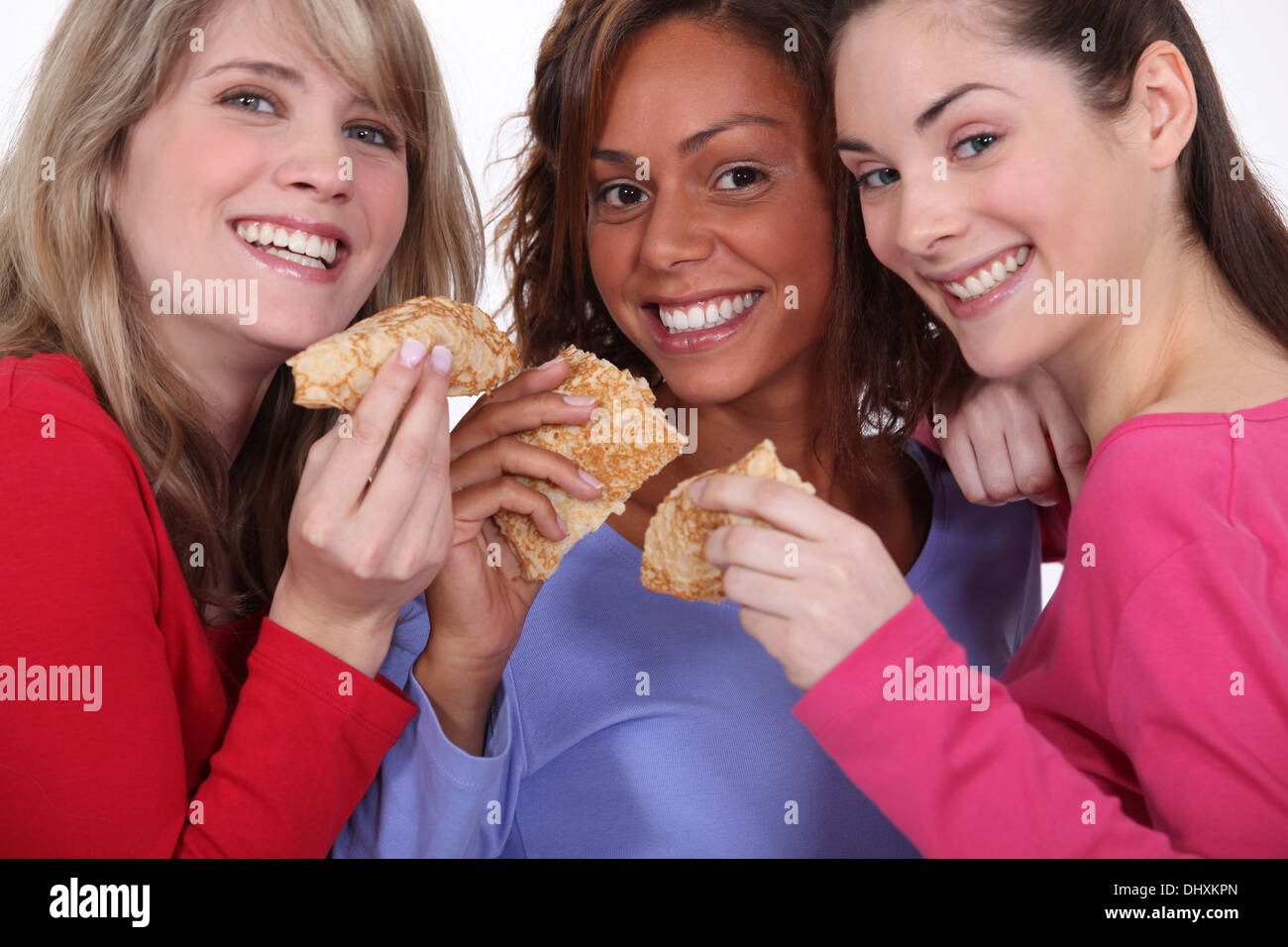 three friends eating pancakes Stock Photo - Alamy