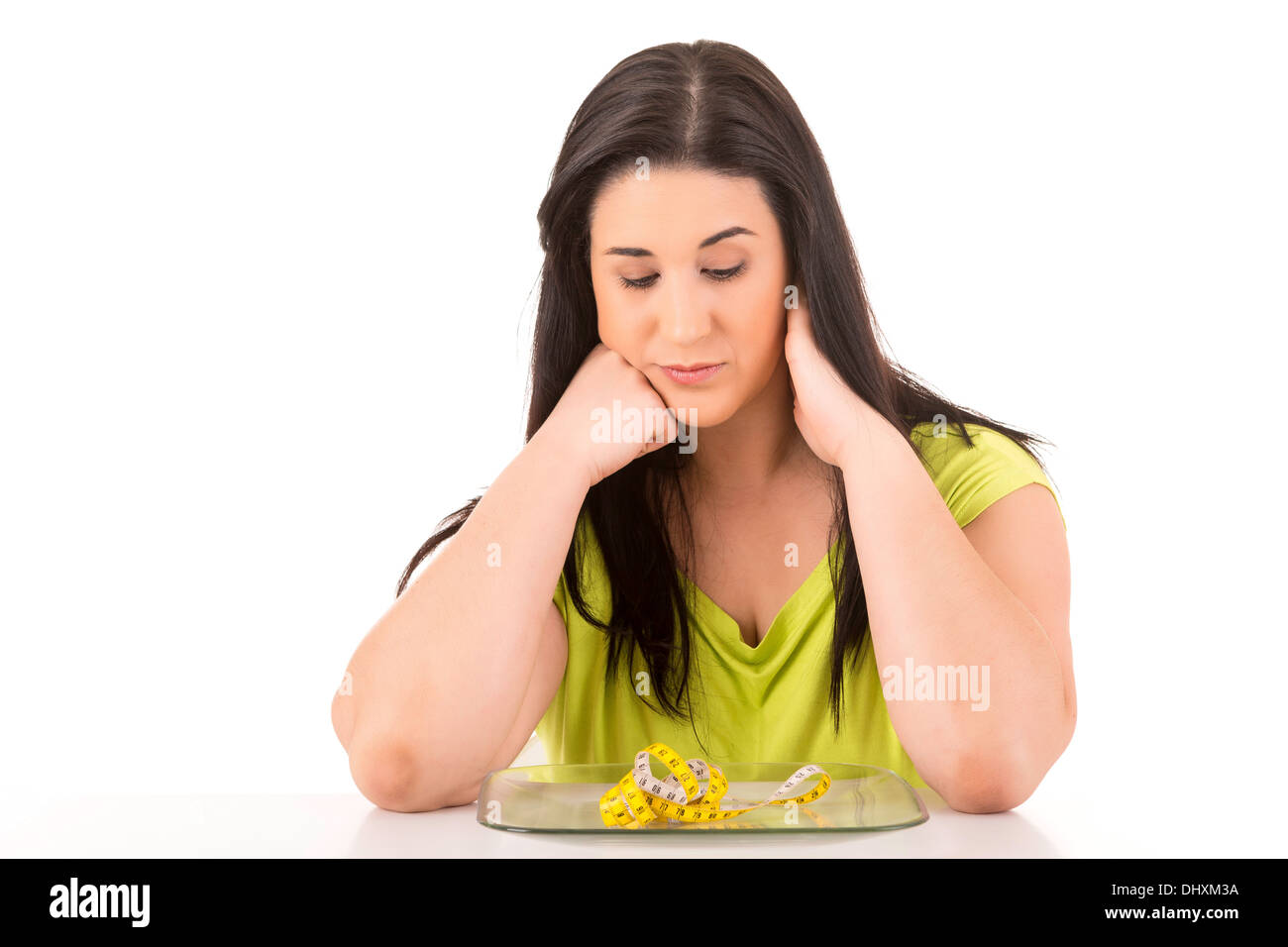 Beautiful large woman, trying to resist to an appetizing hamburger ...