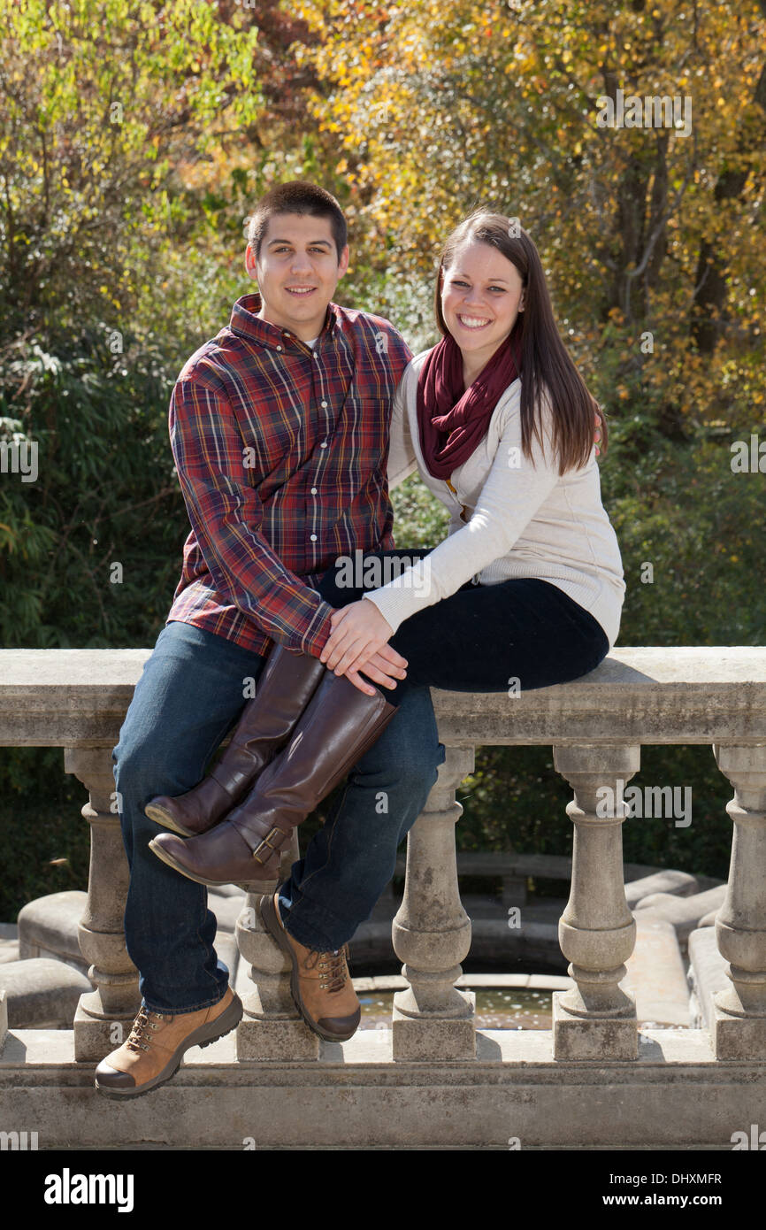Loving couple posing together during the fall / autumn, with natural ...