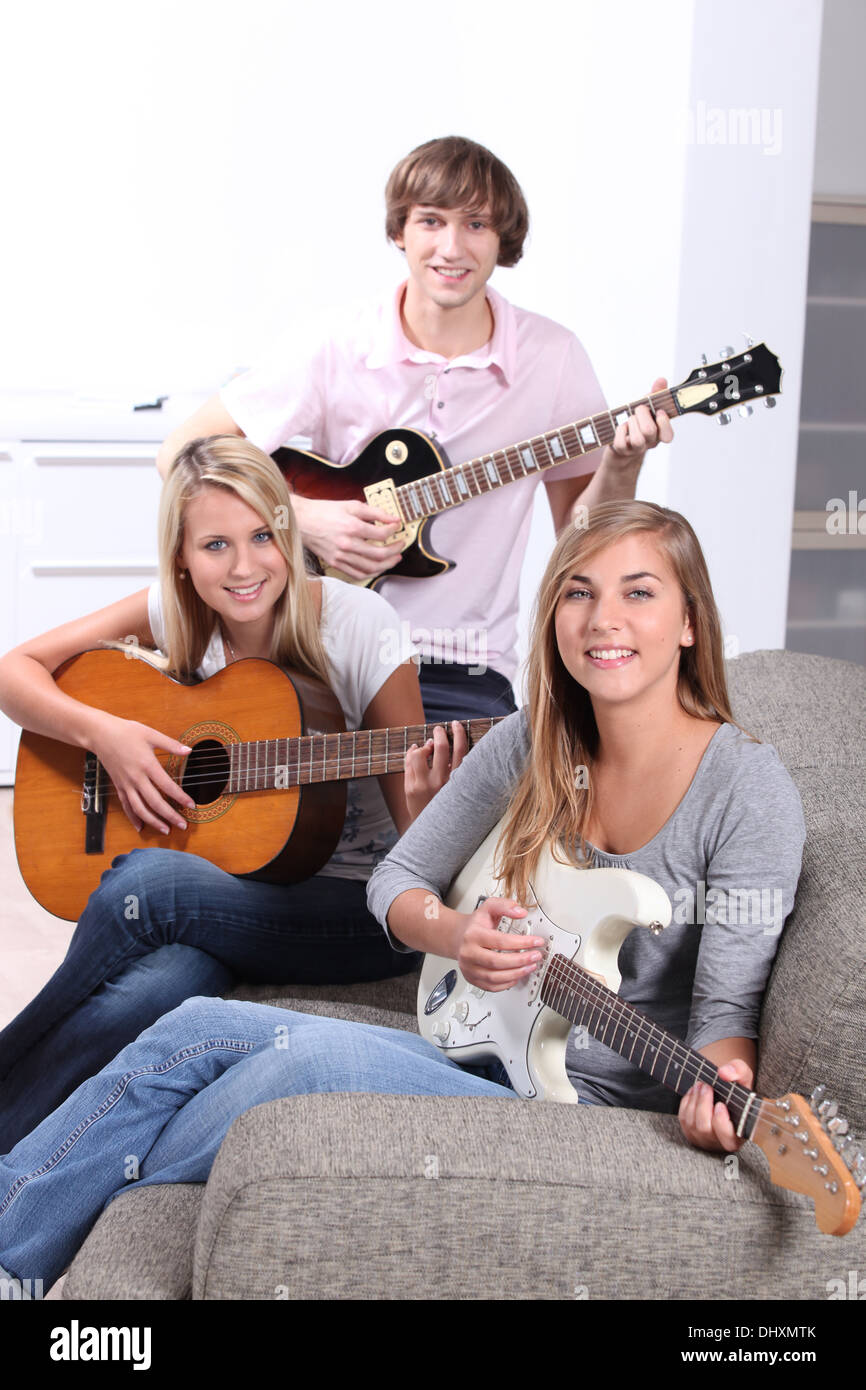 Teen playing guitar Stock Photo - Alamy