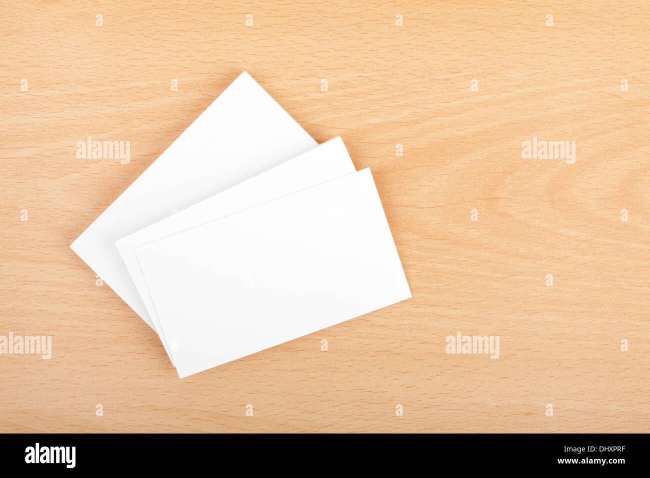 Blank business cards on wooden office table Stock Photo - Alamy