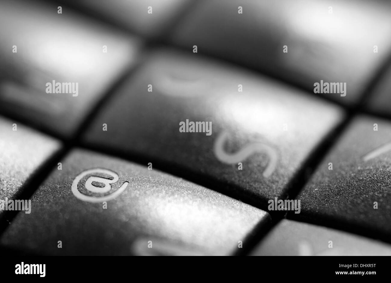 E-mail sign @ on a button Stock Photo - Alamy