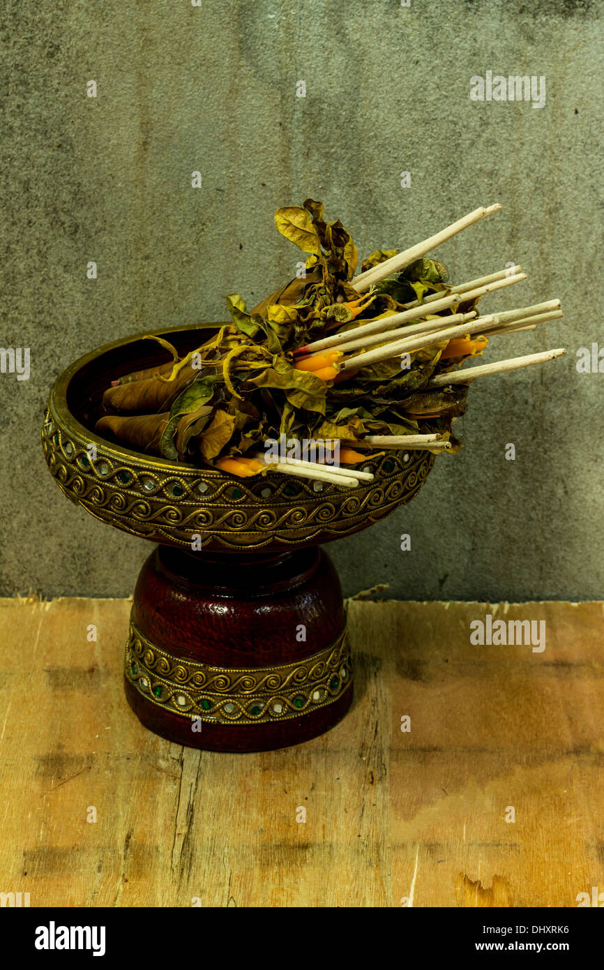 Offerings to Buddha with flowers in tray with pedestal Stock Photo - Alamy