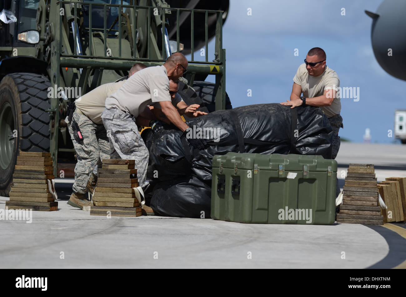 Airmen from the 36th Contingency Response Group rearrange equipment on ...