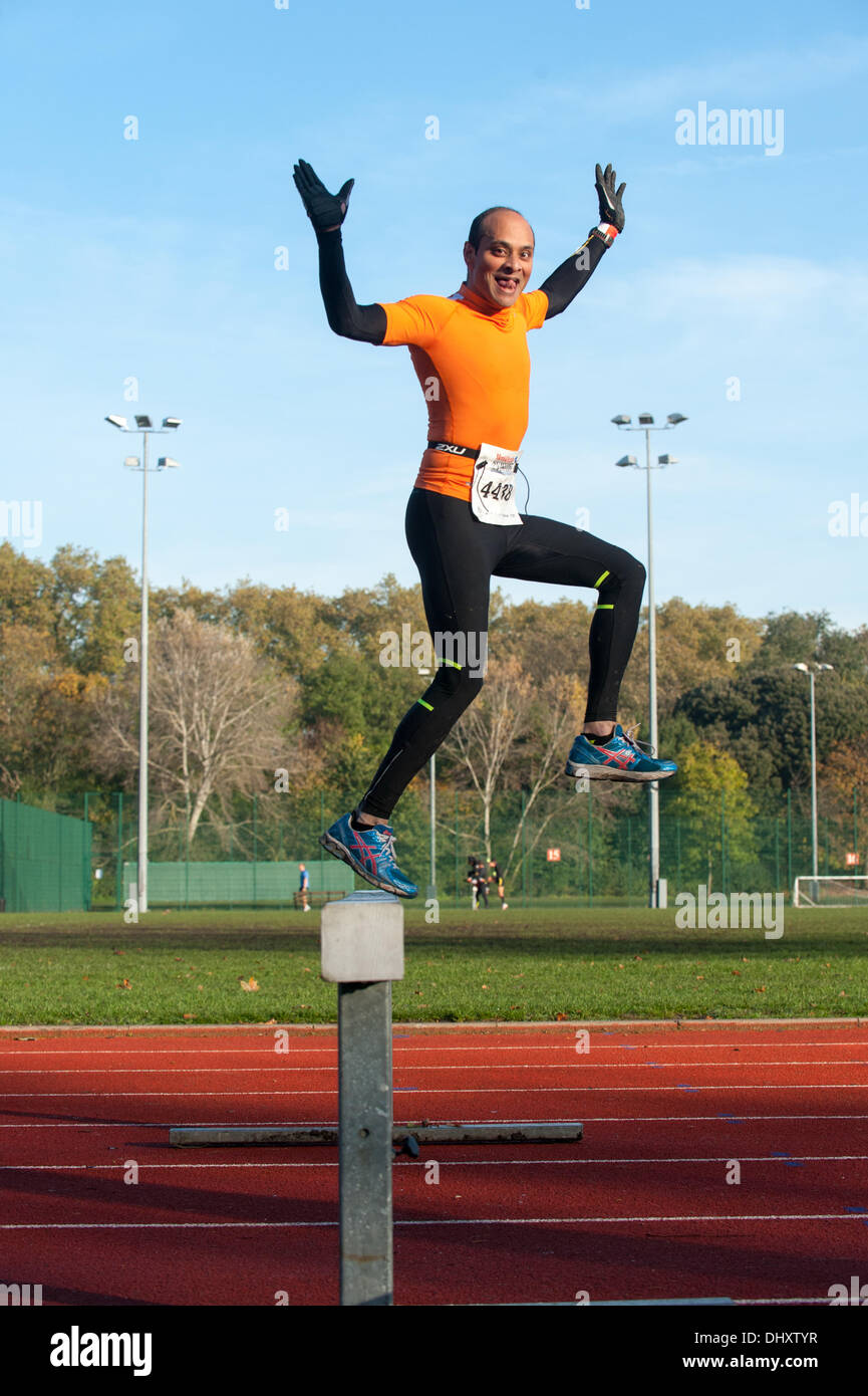 Battersea Park, London, UK. 16th November 2013. Runners race around the ...