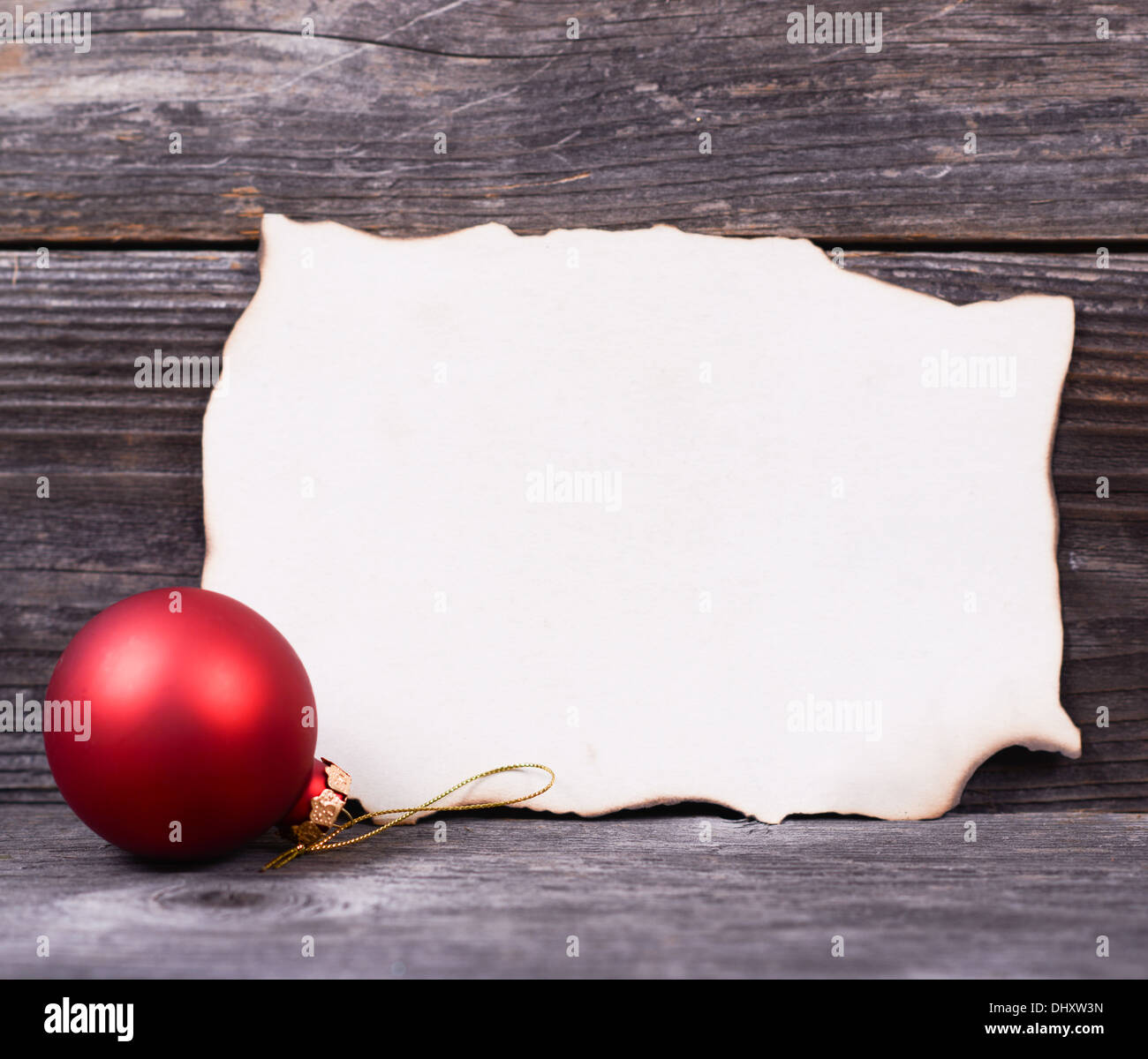 Christmas background with red bauble and blank paper Stock Photo - Alamy