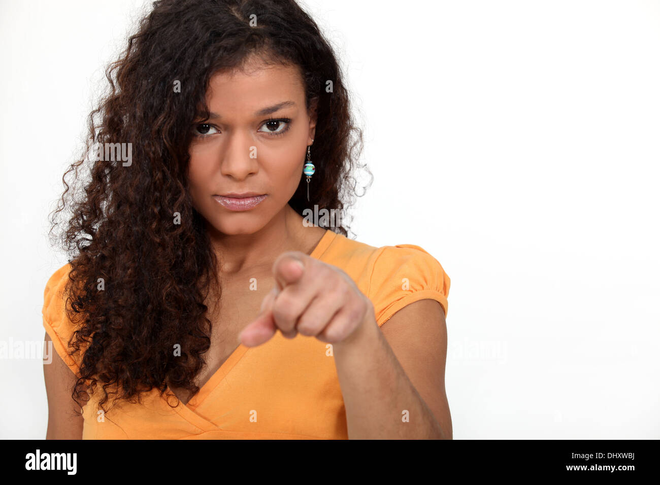Women with curly hair pointing Stock Photo - Alamy
