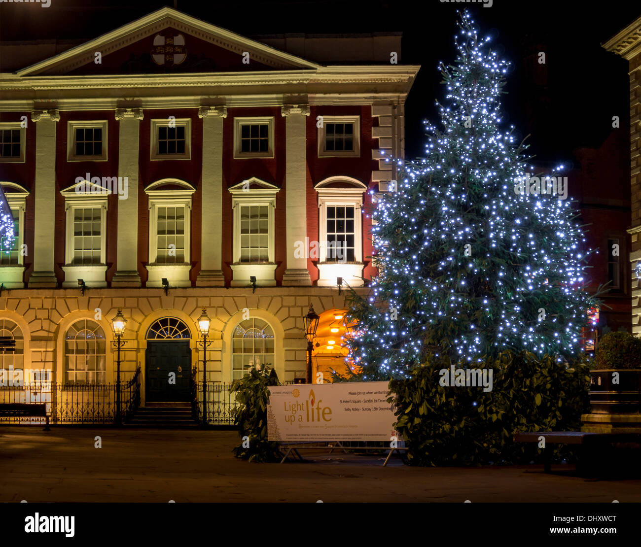 Illuminated Christmas tree at night outside The Mansion House in York ...