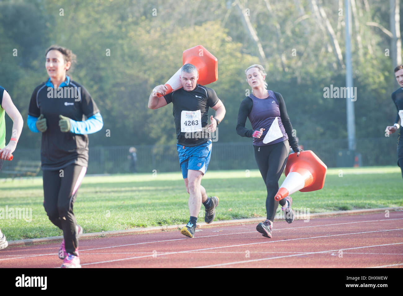 Battersea Park, London, UK. 16th November 2013. Runners race around the ...