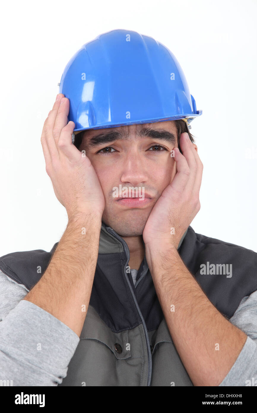 A depressed construction worker Stock Photo - Alamy