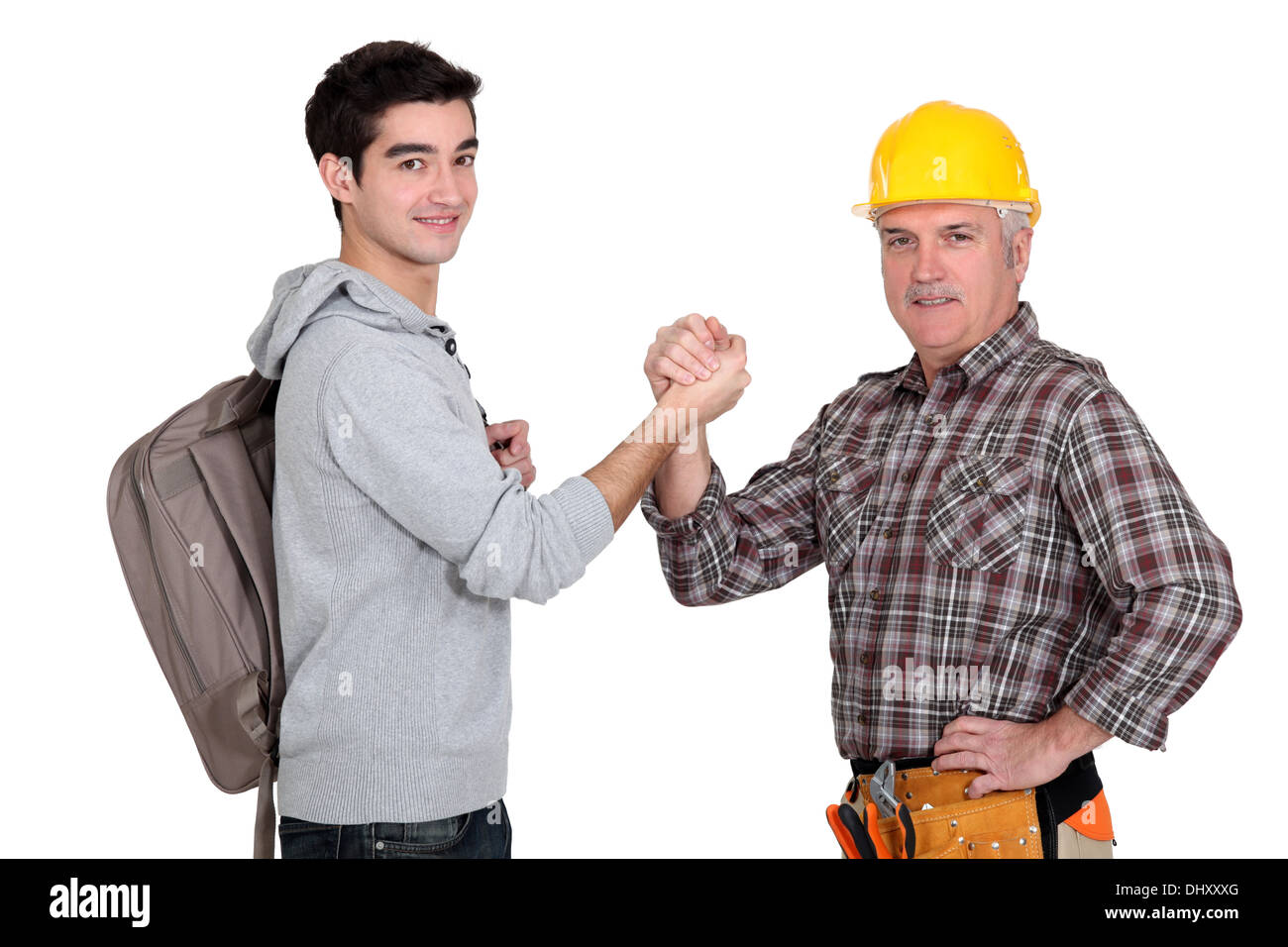 Builder greeting new worker Stock Photo - Alamy