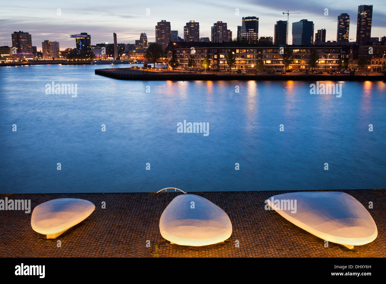 City of Rotterdam skyline at twilight and promenade along the river ...