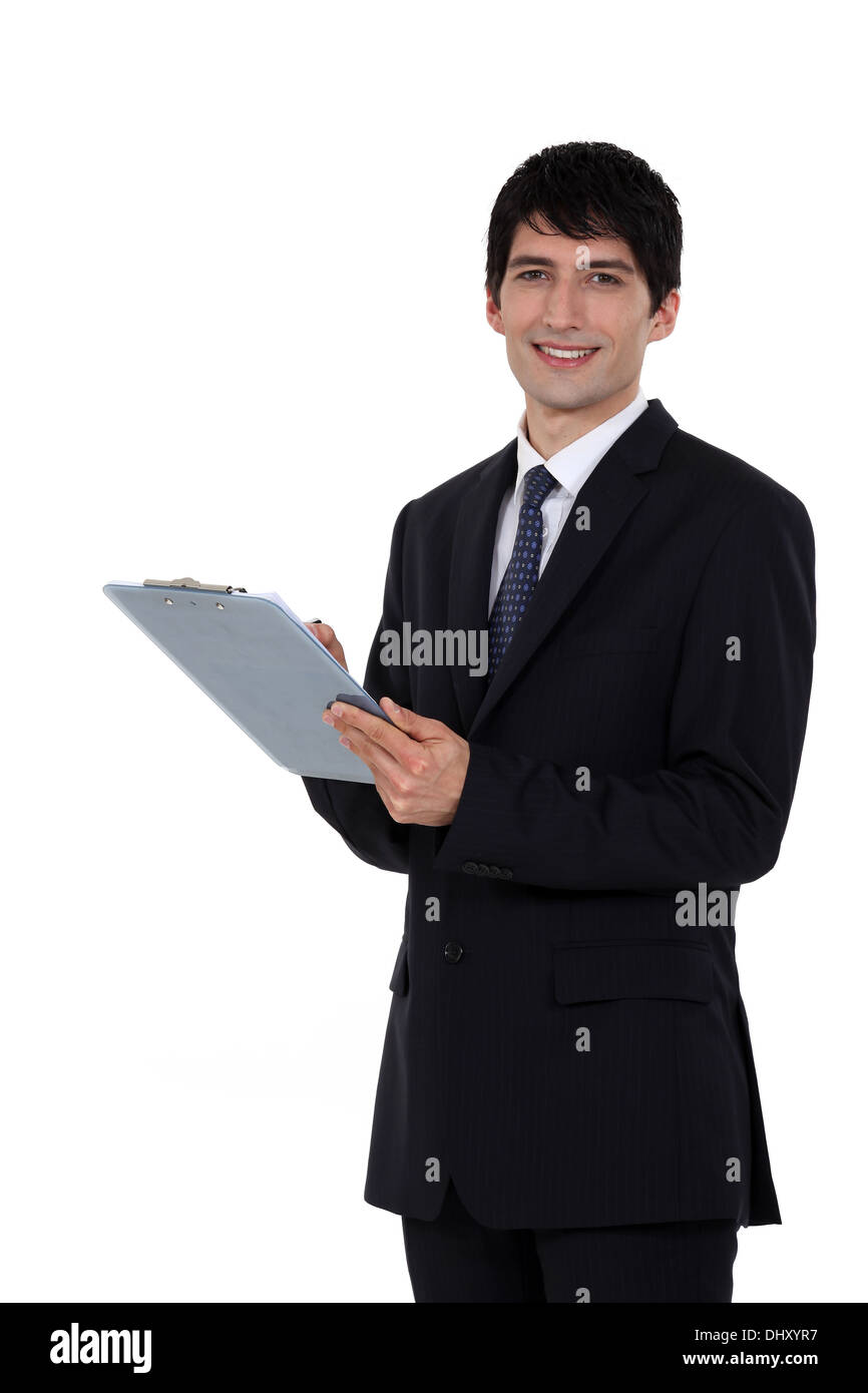 A businessman with a clipboard Stock Photo - Alamy