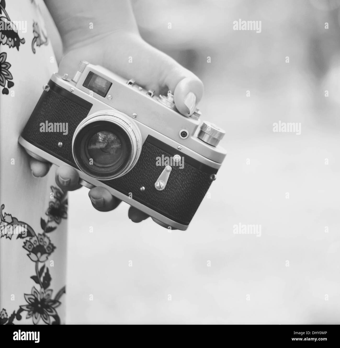 Person holding camera vintage Black and White Stock Photos & Images - Alamy