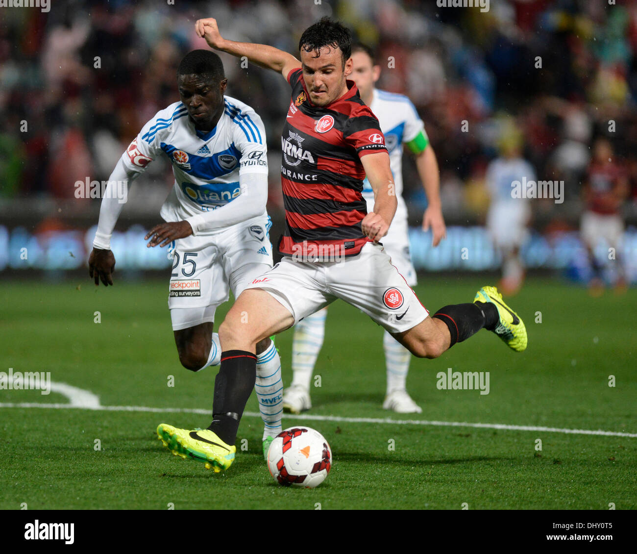 16.11.2013 Sydney, Australia. Wanderers forward Mark Bridge breaks ...