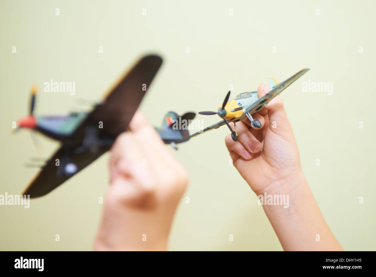 Child blond boy playing - flying with world war II airplanes fighters ...
