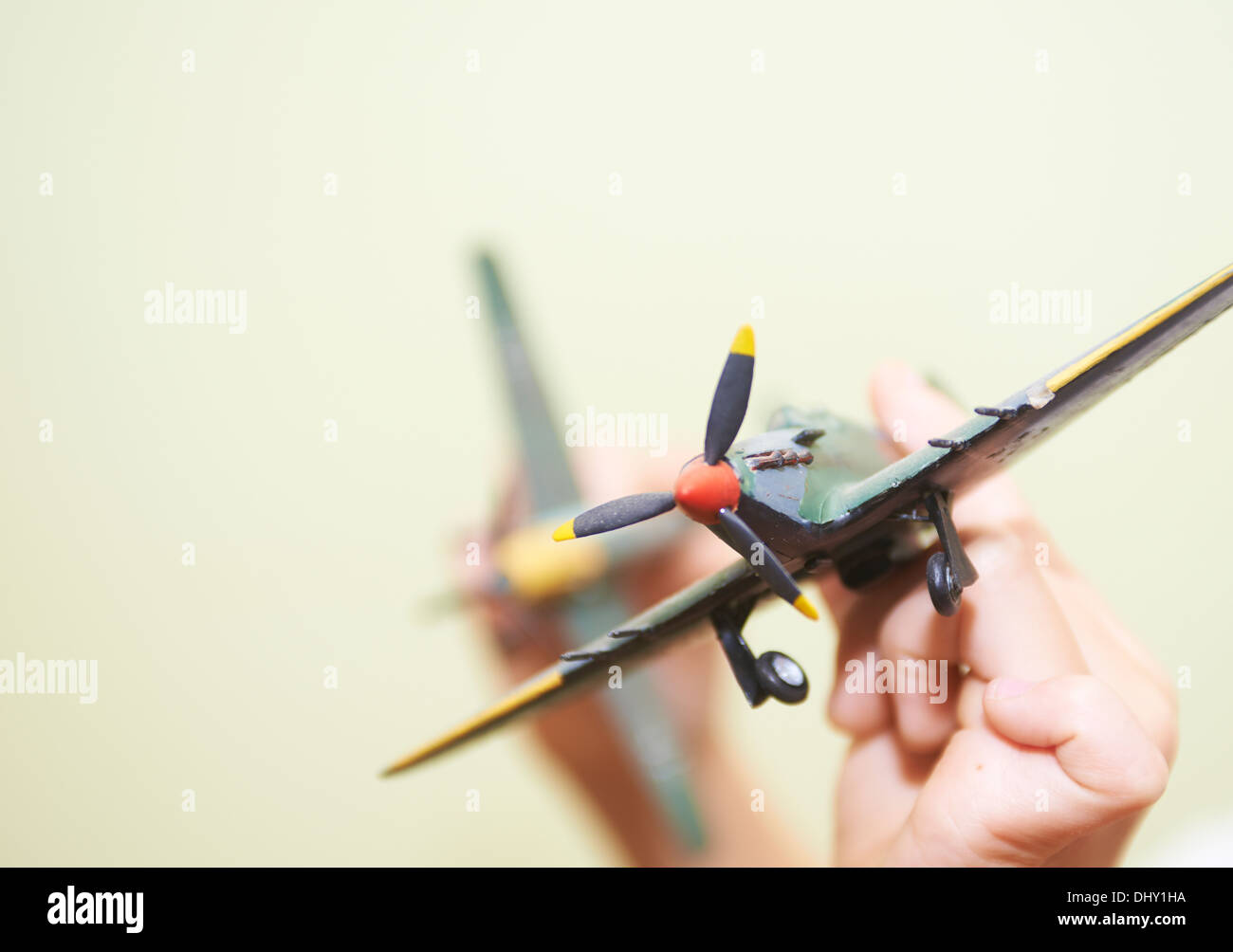 Child blond boy playing - flying with world war II airplanes fighters ...