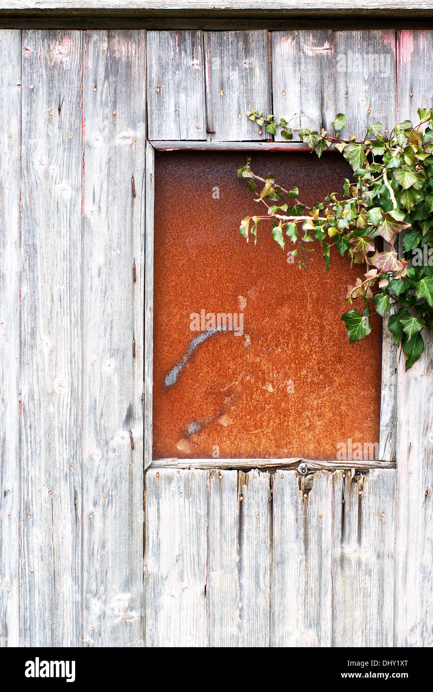 Wooden door with rusty metal in window frame Stock Photo - Alamy