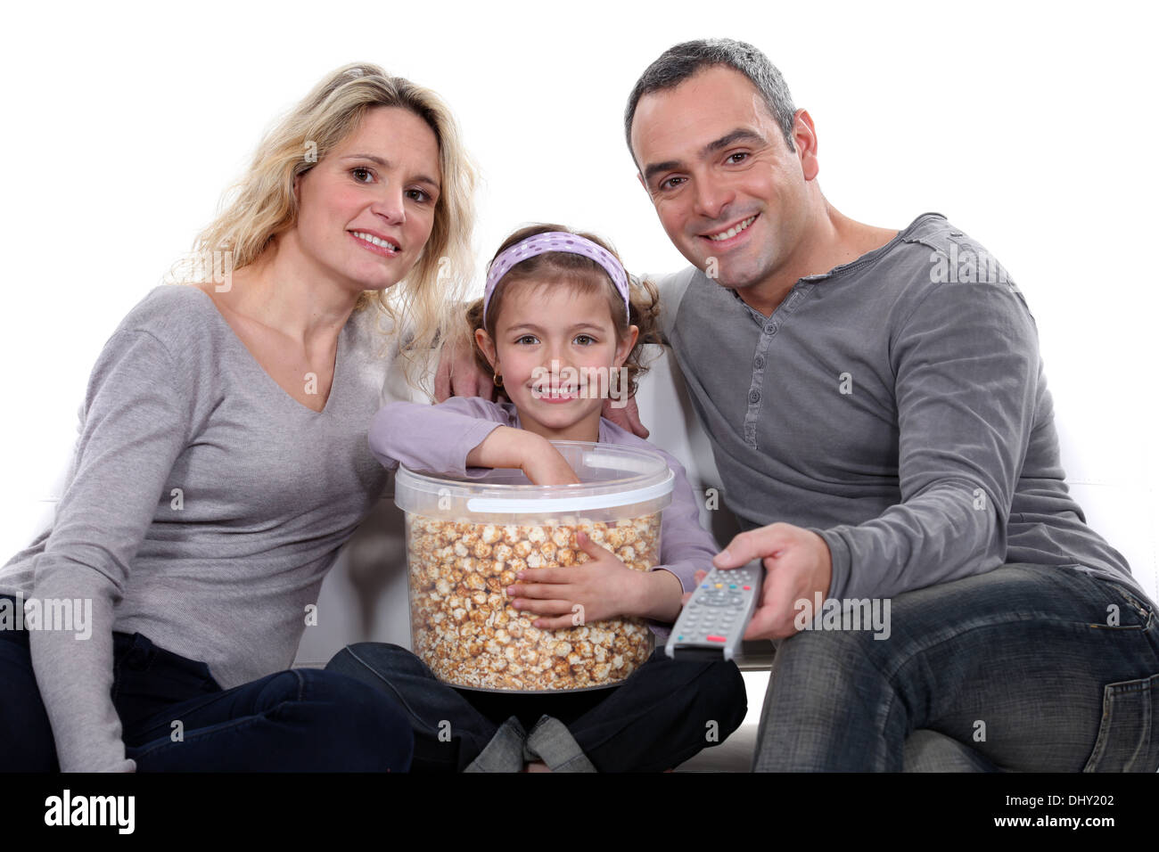 Family with a huge tub of popcorn Stock Photo - Alamy
