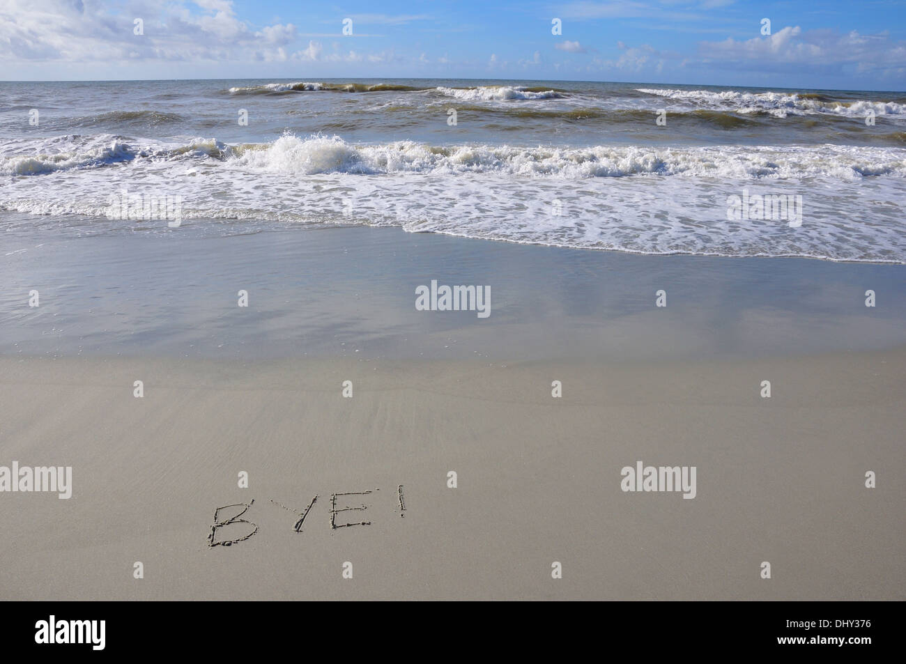Seashore with BYE! written on the sand Stock Photo - Alamy