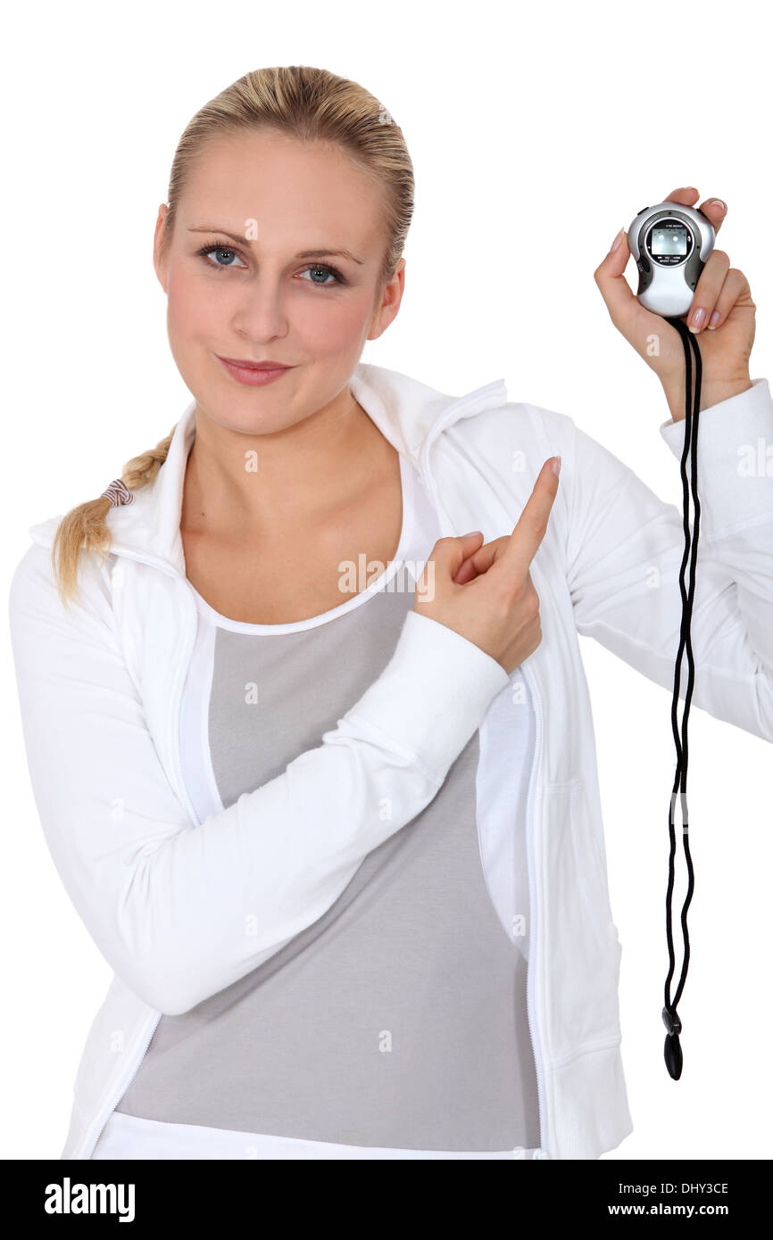 Woman runner with a stopwatch Stock Photo - Alamy