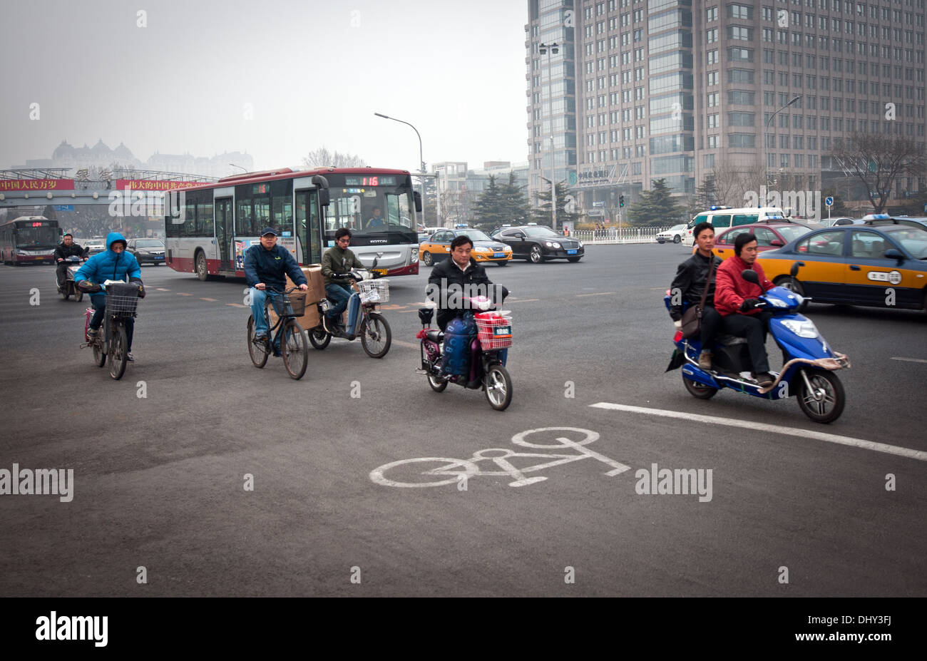 Chinese people riding scooters in hi-res stock photography and images ...