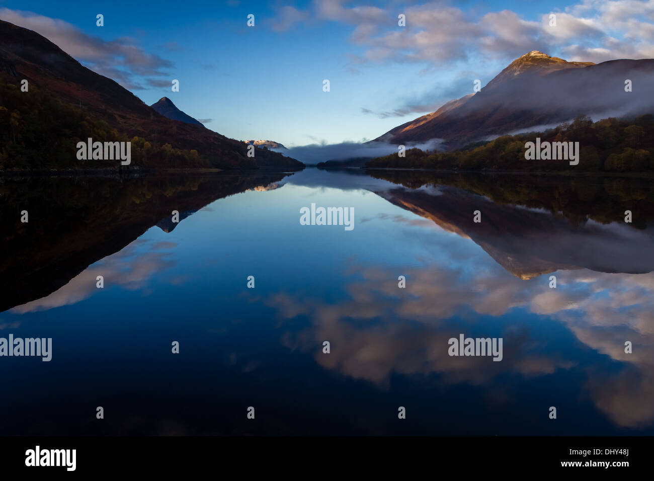 Dramatic early morning reflection and mist on Loch Leven, Scotland, UK ...