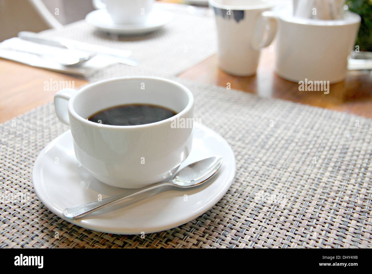 White Coffee cup on the table in the morning Stock Photo - Alamy