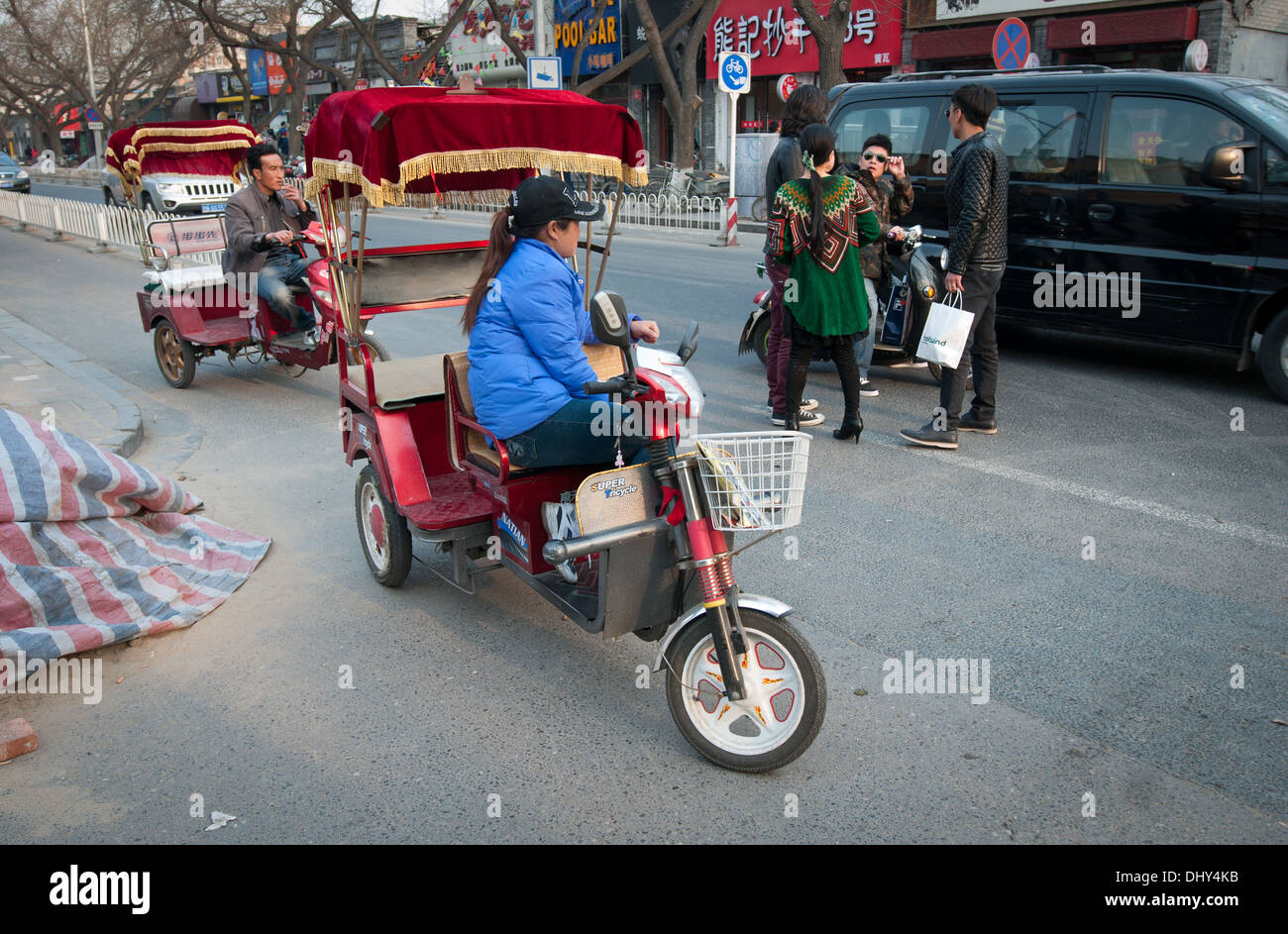 three wheeler electric rickshaw at Famous Gulou East Street in Beijing ...
