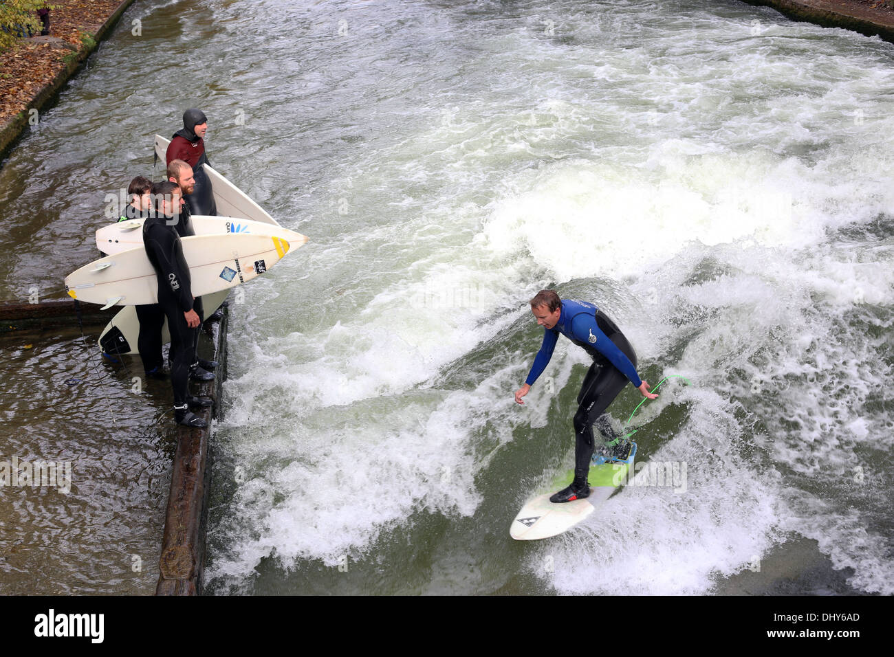 Surfers train on a man-made wave about 1 metre high in the Eisbach ...