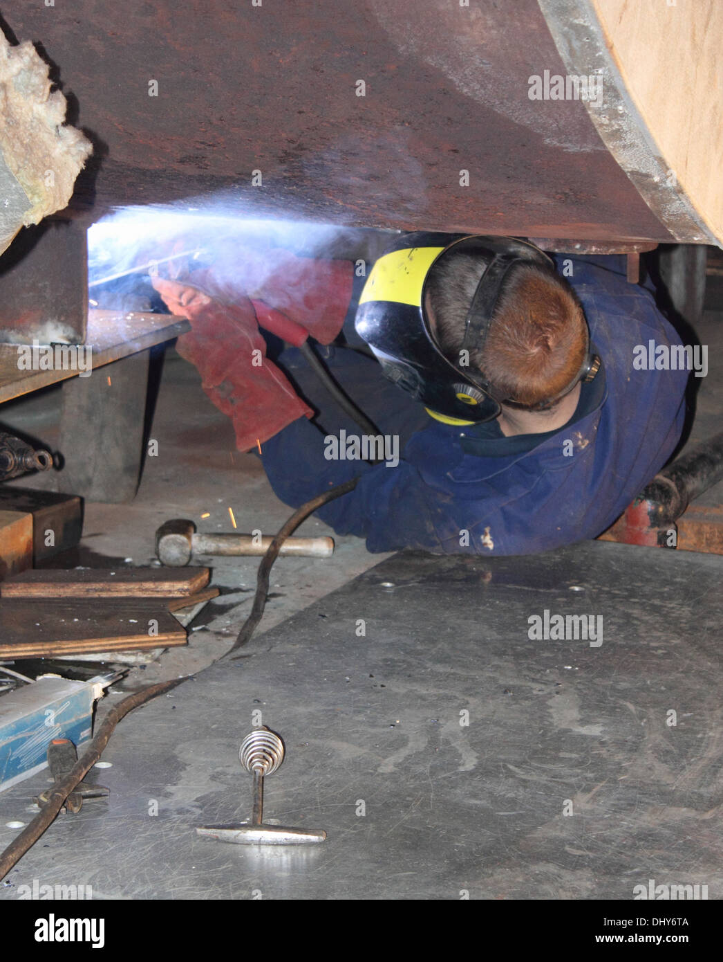 A welder welding a repair on a steam boiler Stock Photo - Alamy