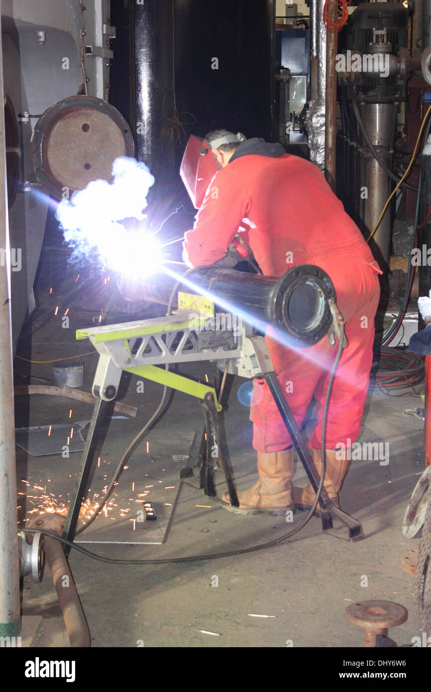 A welder wearing his full personal protection equipment, ppe Stock ...
