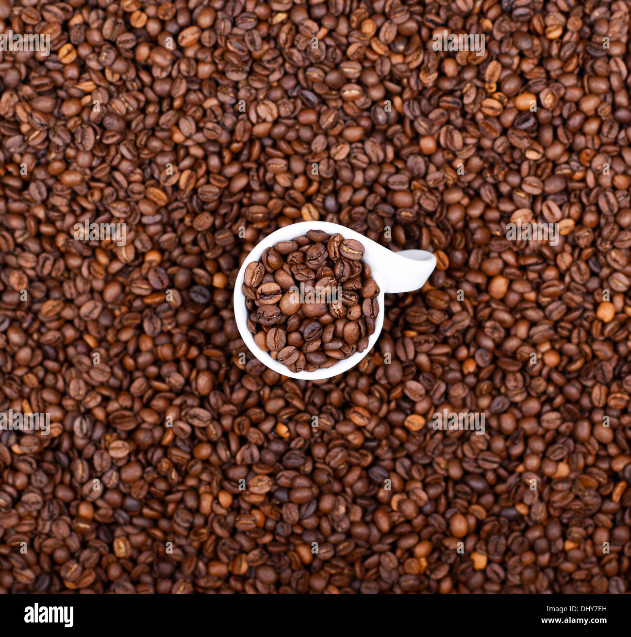 Cup of coffee filled with coffee beans abstract view Stock Photo - Alamy