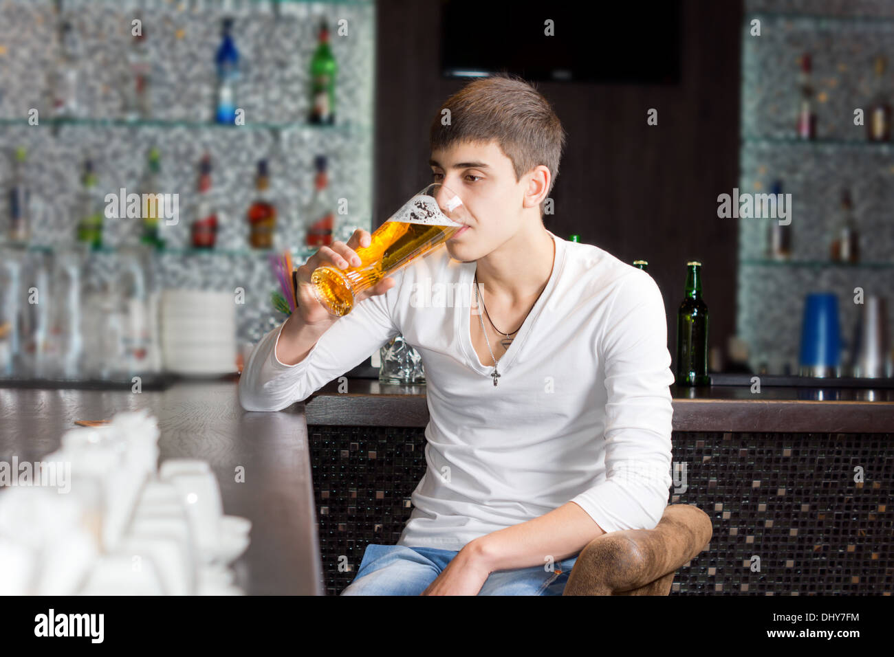 Man sitting in a pub drinking a pint of beer hi-res stock photography ...
