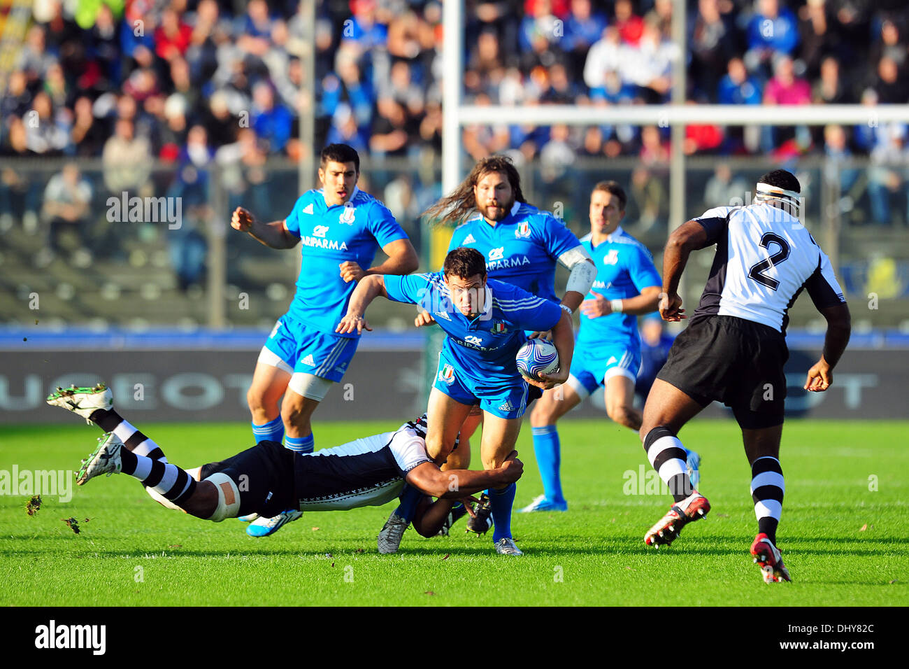 Cremona, Italy. 16th Nov, 2013. Luca Morisi is tackled by Nemani Nadolo ...