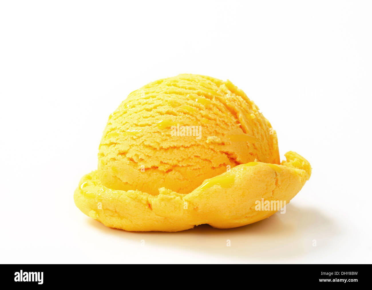 Scoop of yellow ice cream on white background Stock Photo - Alamy